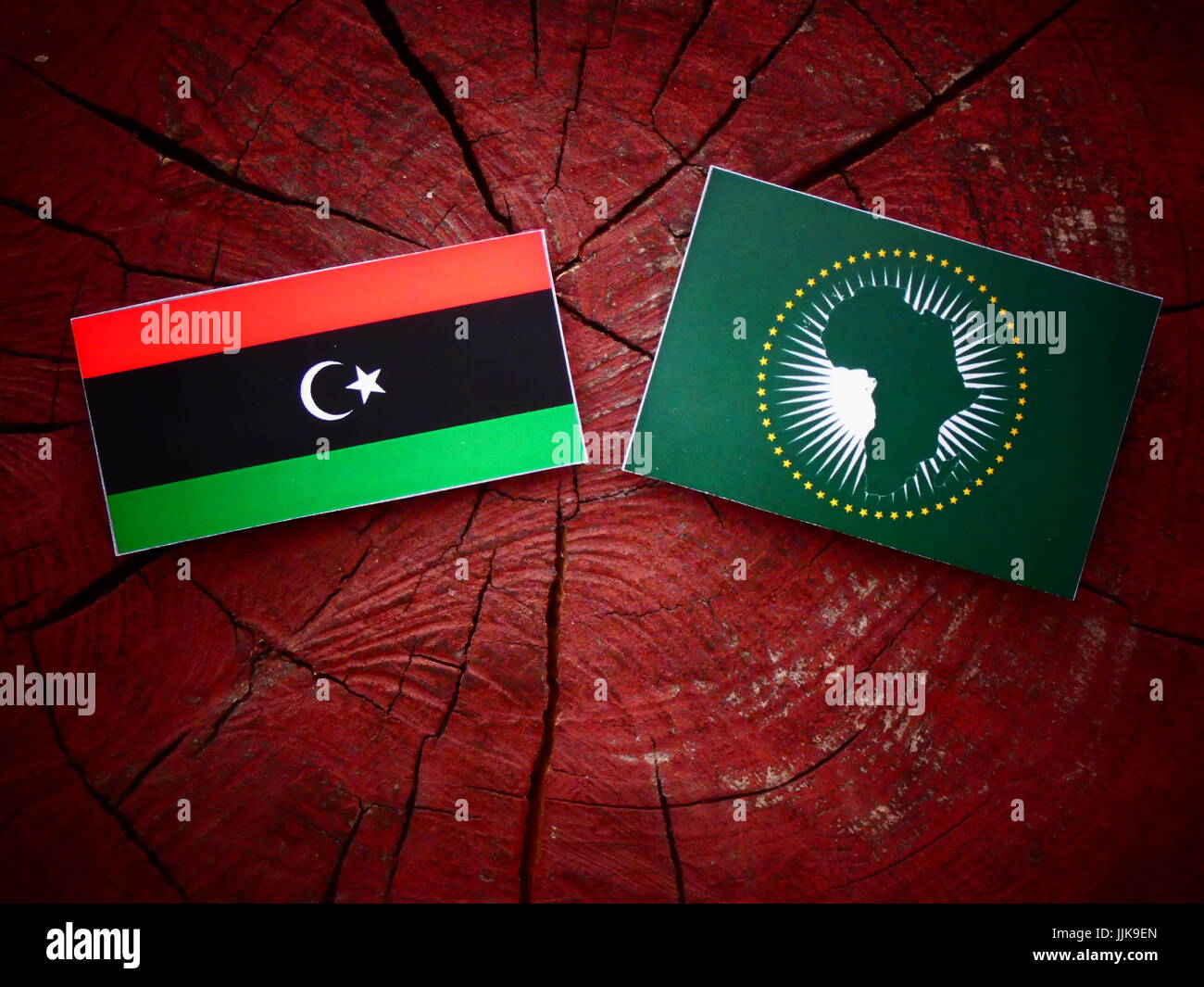 Libyan flag with African Union flag on a tree stump isolated Stock ...