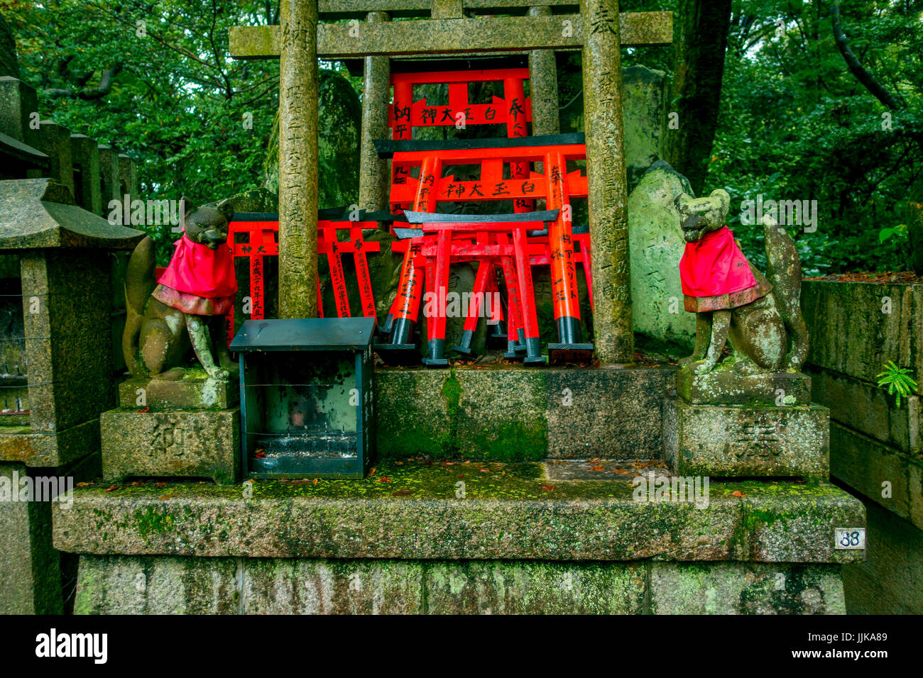 KYOTO, JAPAN - JULY 05, 2017: Fox stone statue at Fushimi Inari Shrine ...