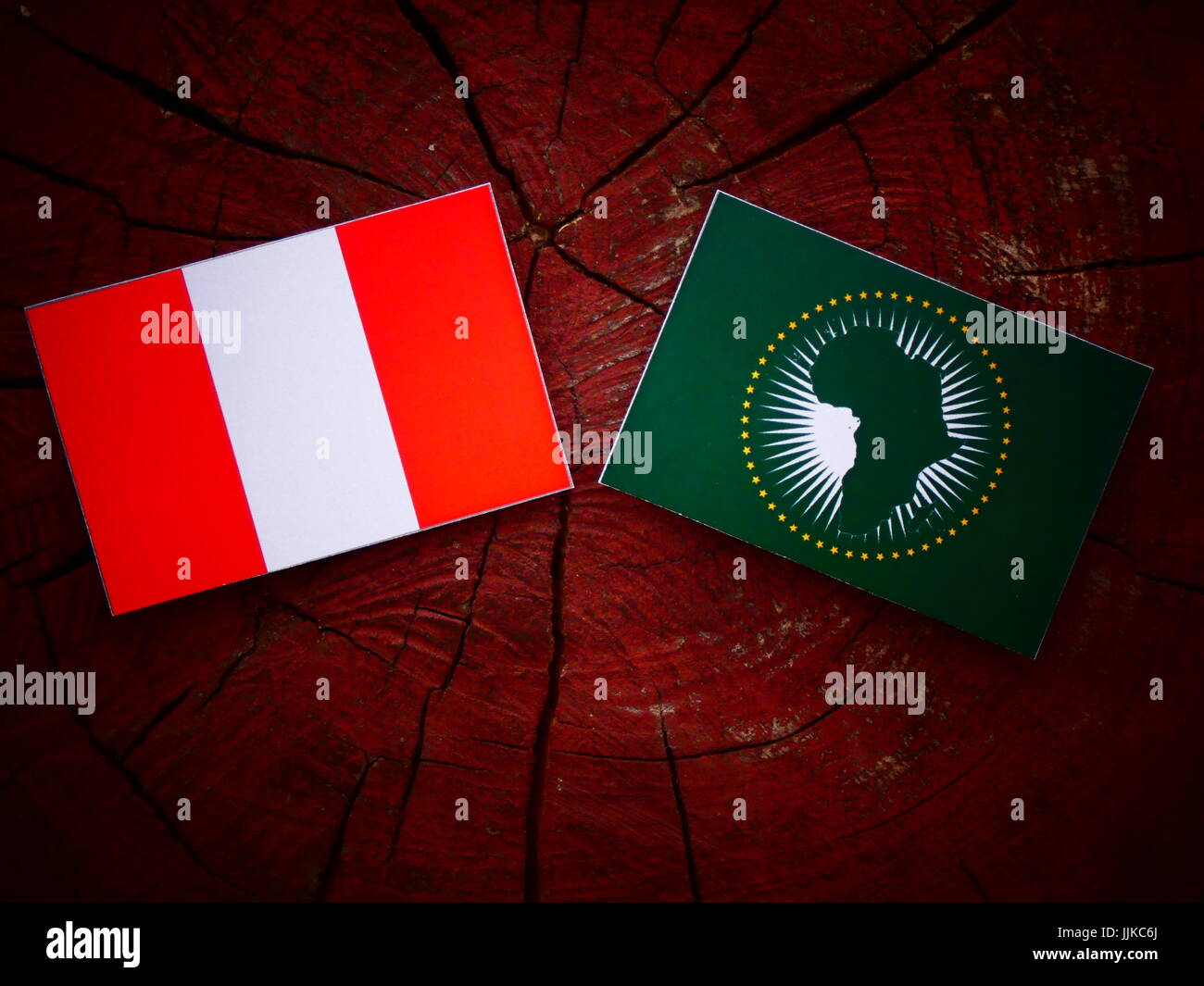 Peruvian flag with African Union flag on a tree stump isolated Stock ...