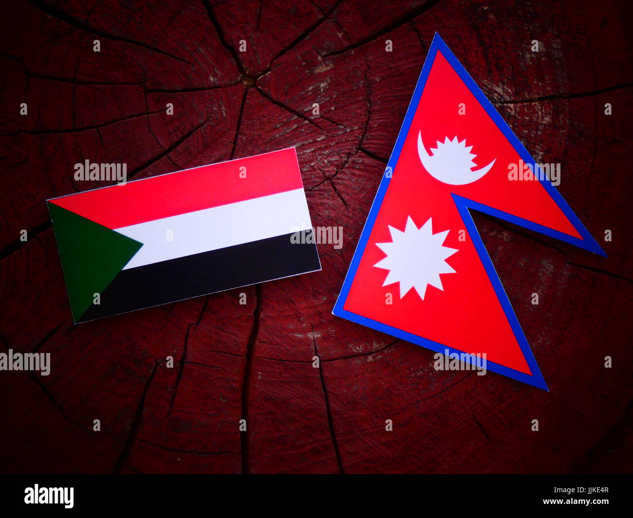 Sudan flag with Nepali flag on a tree stump isolated Stock Photo - Alamy