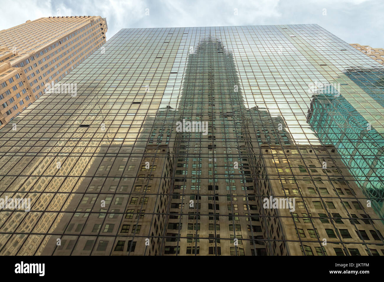 Reflections of the Empire State Building on the glass windows of the ...