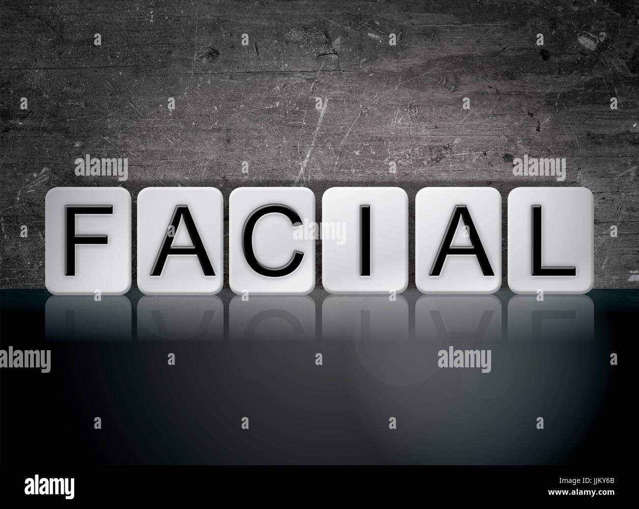 The word Facial concept and theme written in white tiles on a dark ...