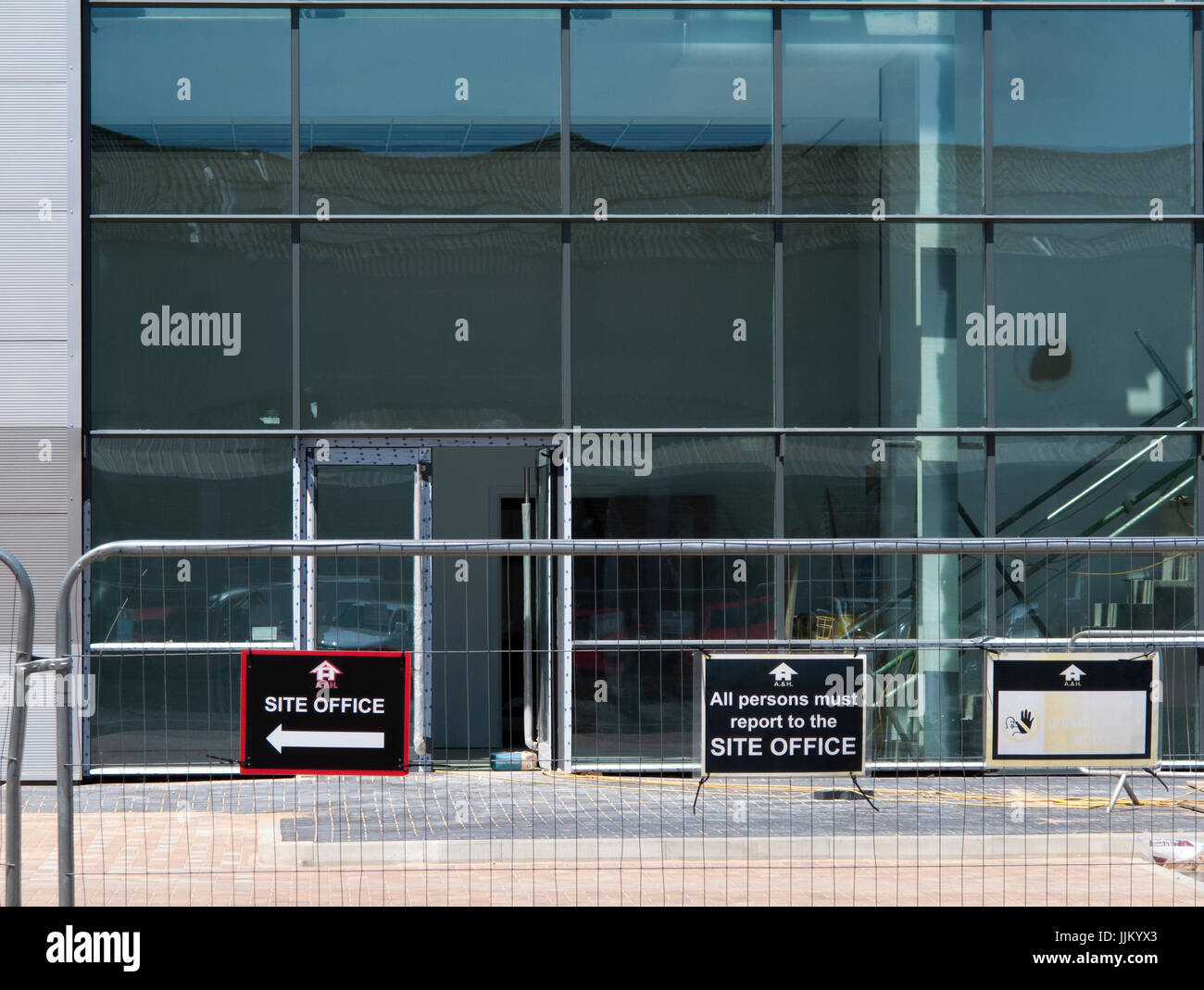 Site Office sign mounted on security fencing, new commercial warehouse ...