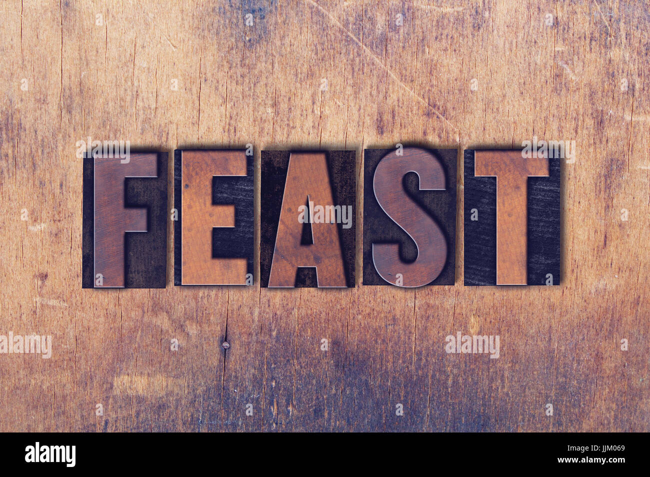 The word Feast concept and theme written in vintage wooden letterpress ...