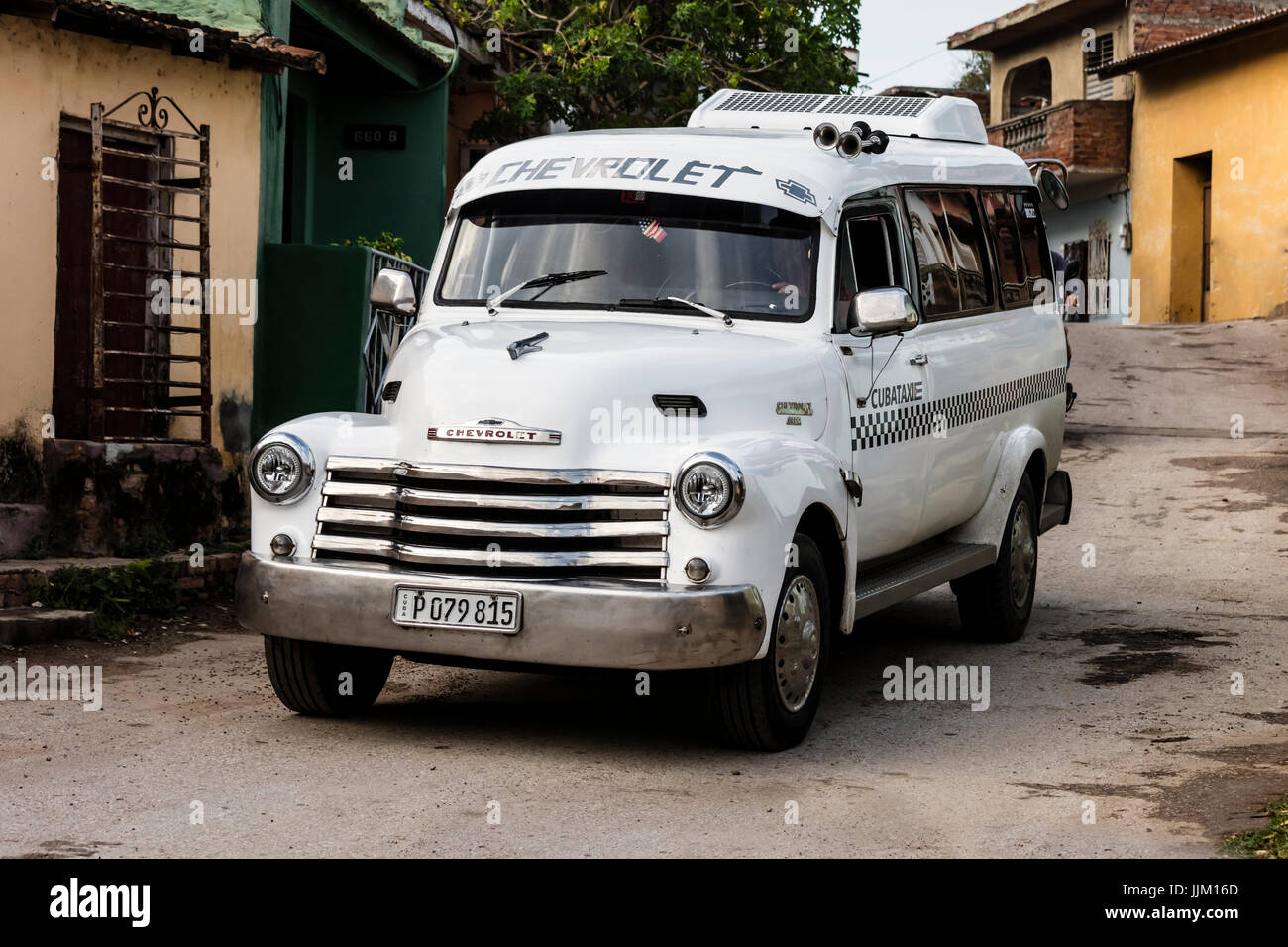 CLASSIC AMERICAN CARS are part of the charm of TRINIDAD, CUBA Stock ...