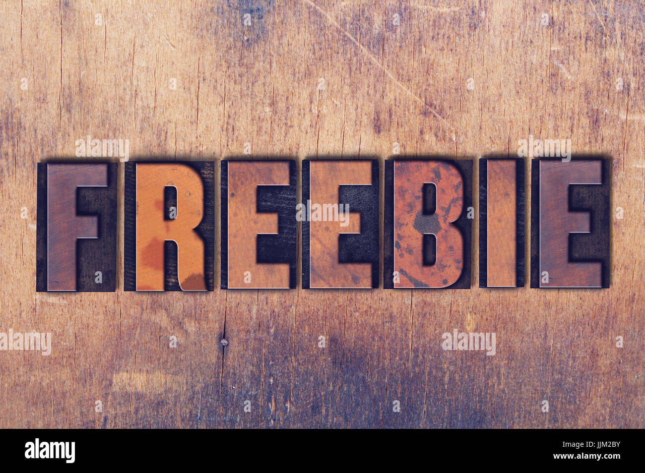 The word Freebie concept and theme written in vintage wooden ...