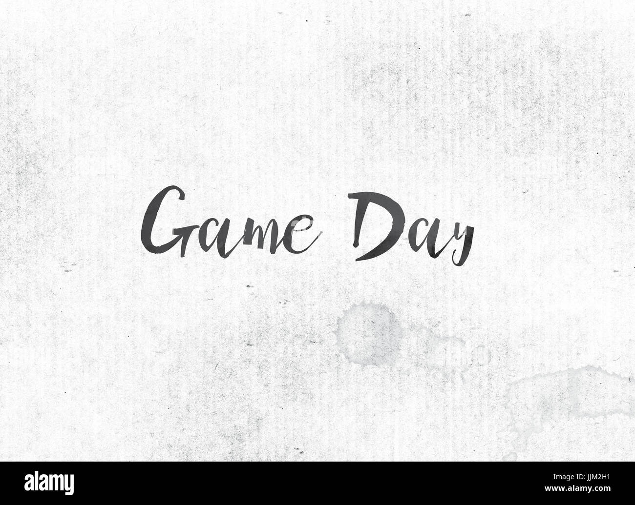 The words Game Day concept and theme painted in black ink on a ...