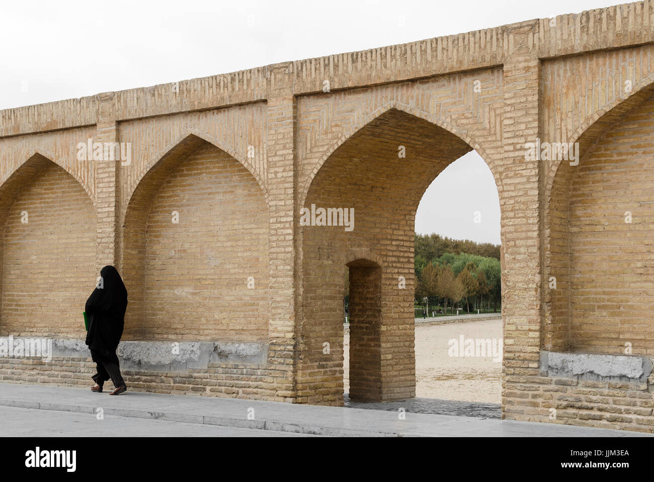 Veiled passenger on Siosepol bridge sidewalk, Isfahan, Iran Stock Photo ...