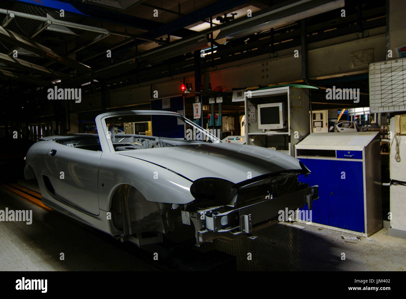 An abandoned MG TF sportscar left abandoned on the assembly line inside ...
