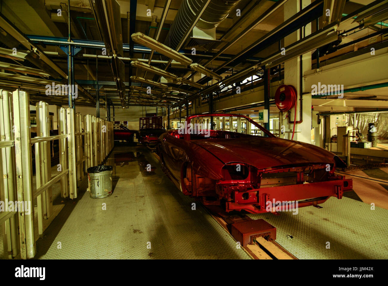 An abandoned MG TF sportscar left abandoned on the assembly line inside ...