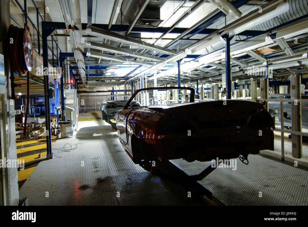 An abandoned MG TF sportscar left abandoned on the assembly line inside ...