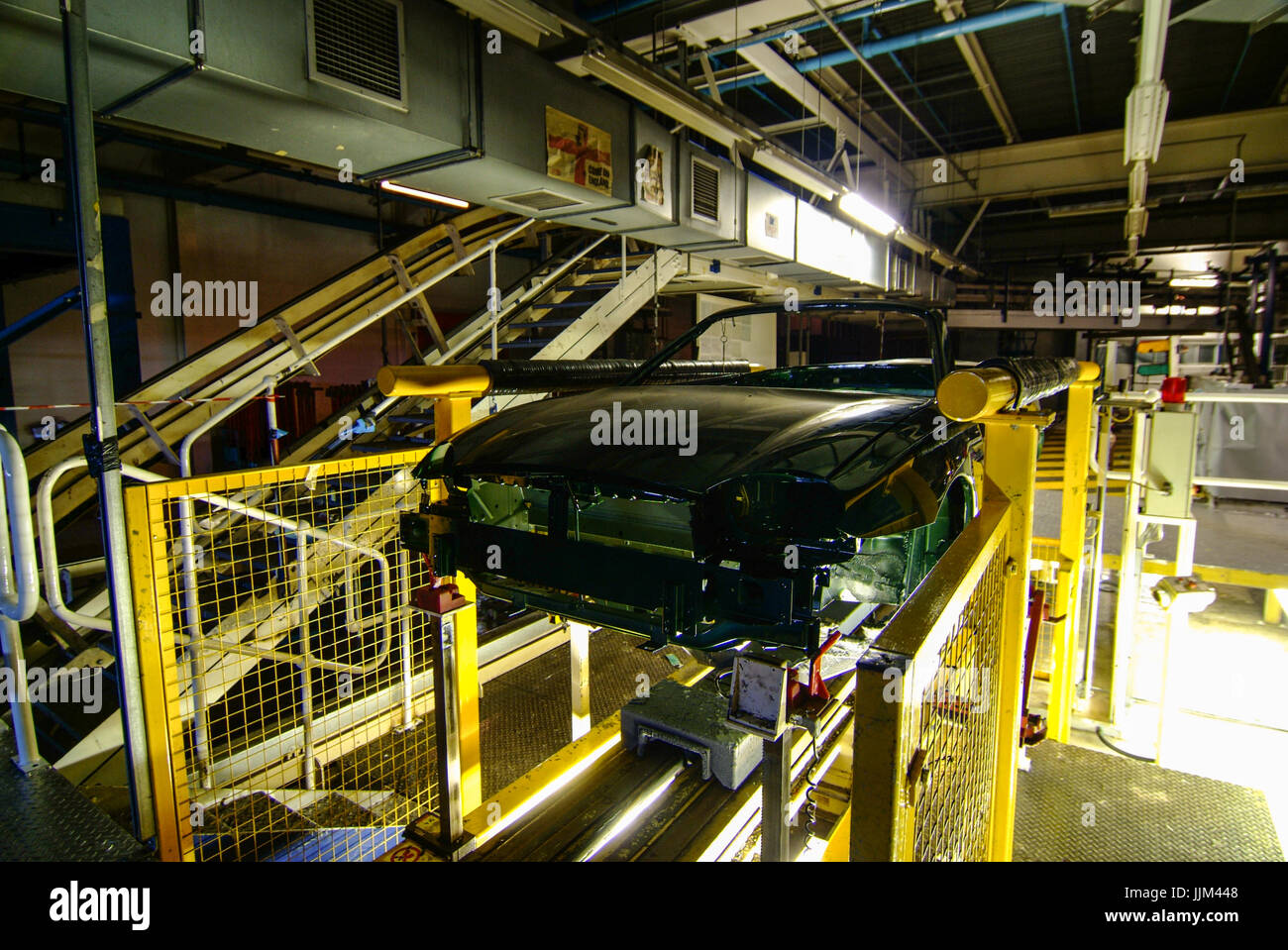 An abandoned MG TF sportscar left abandoned on the assembly line inside ...
