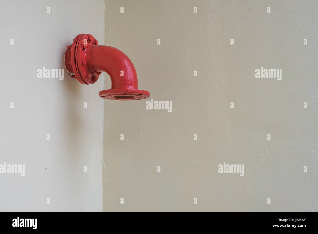 Red metal vent round industrial pipe on the white wall Stock Photo - Alamy