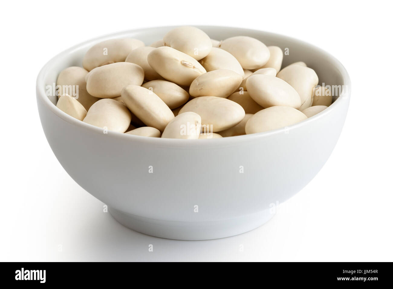 Dry butter beans in white ceramic bowl isolated on white Stock Photo ...