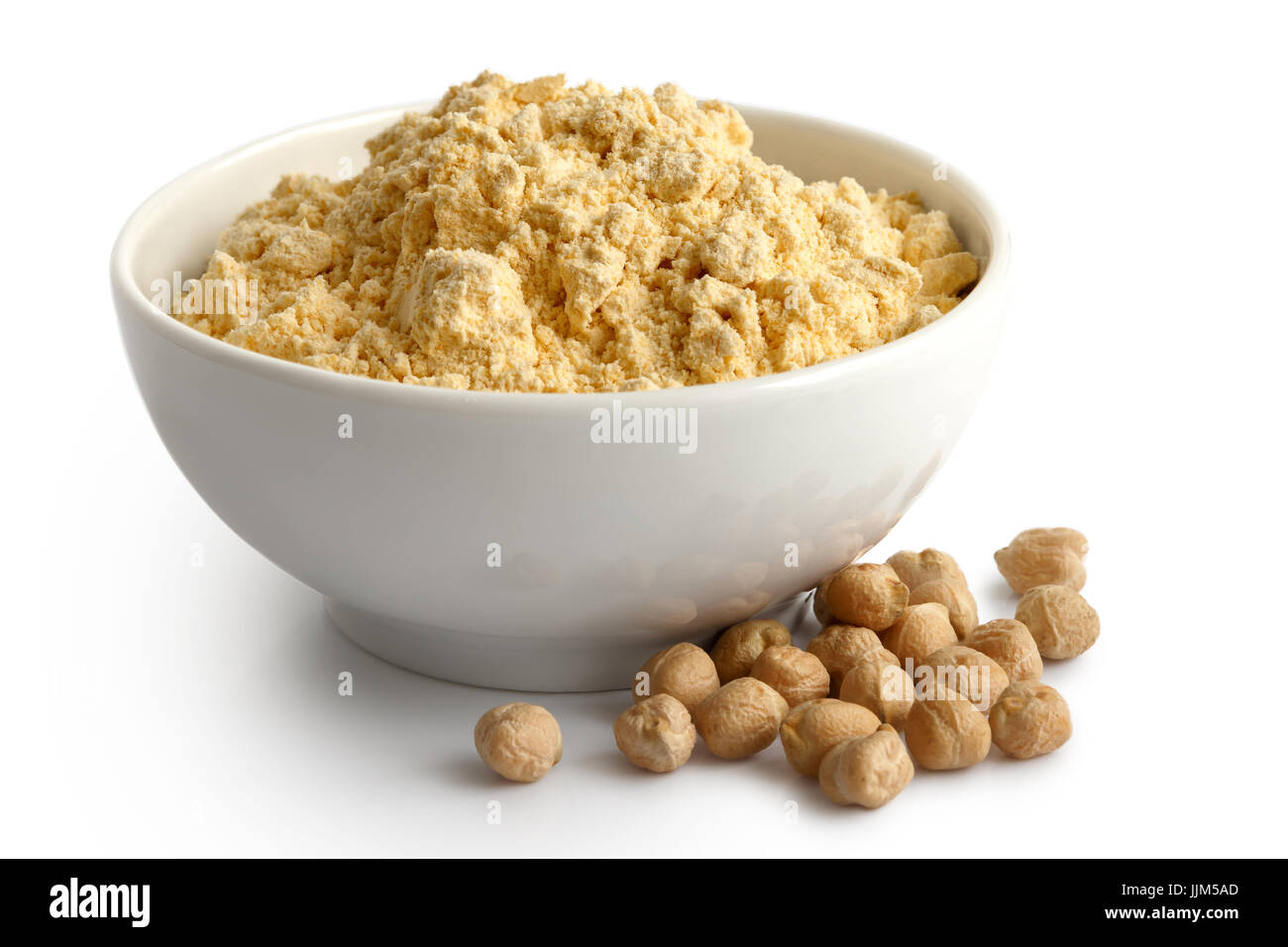 Chickpea flour in white ceramic bowl isolated on white. Spilled ...