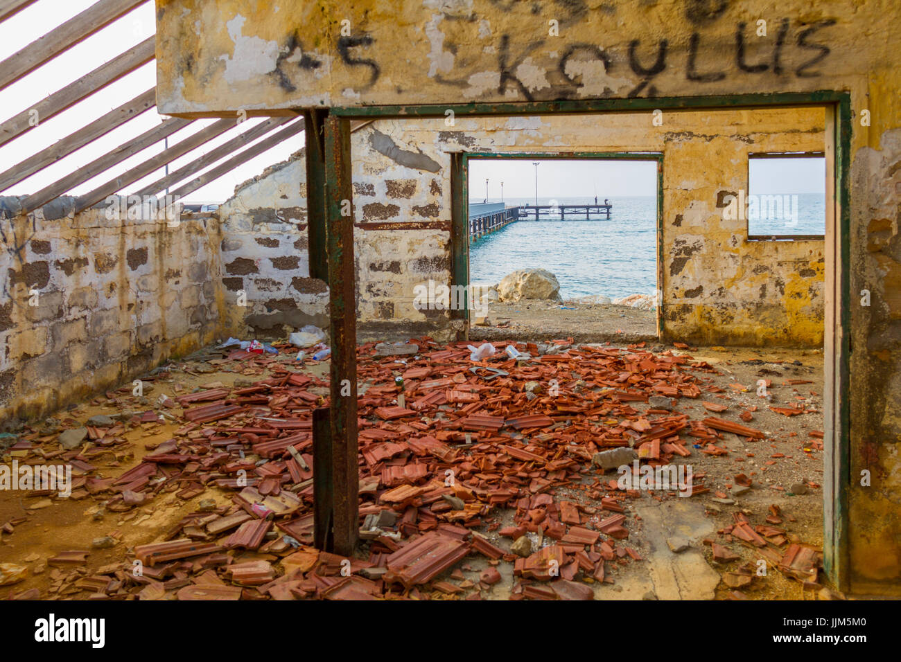 Pier view through derelict house by the beach in Argaka, Cyprus Stock ...