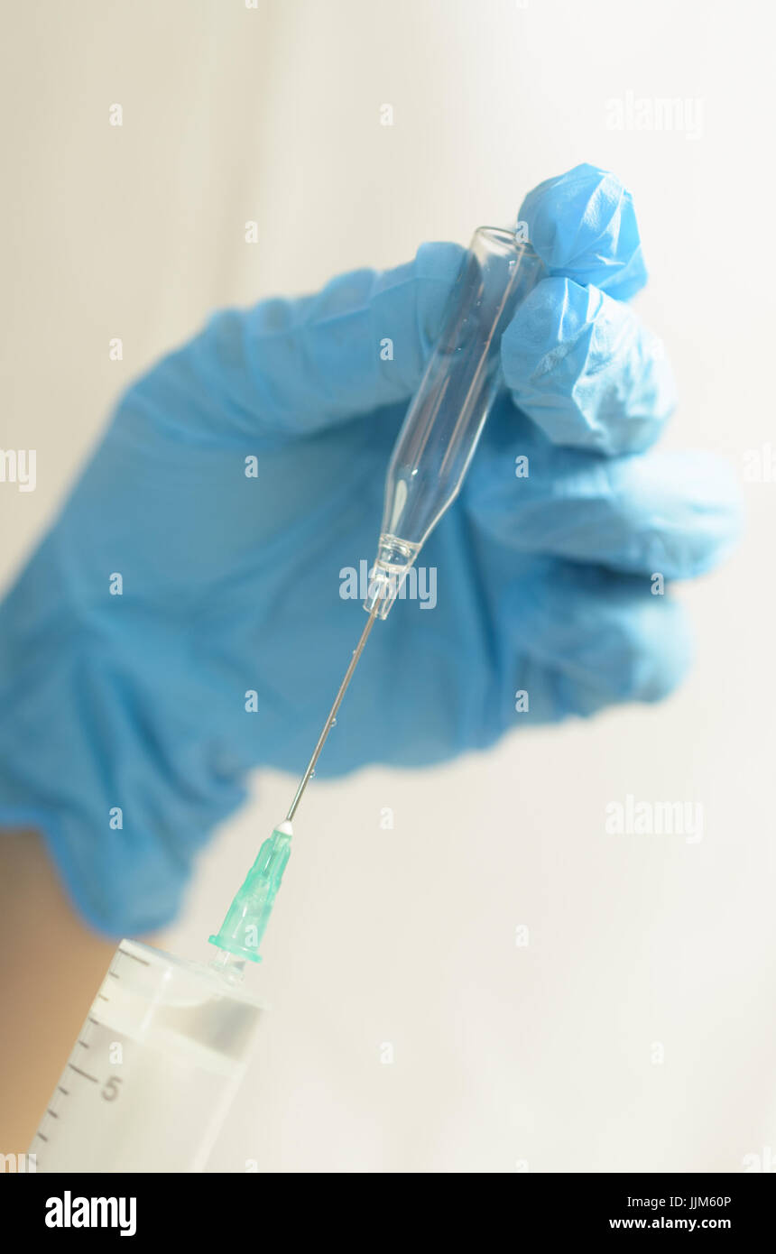 The doctor makes tests with a biological fluid Stock Photo - Alamy