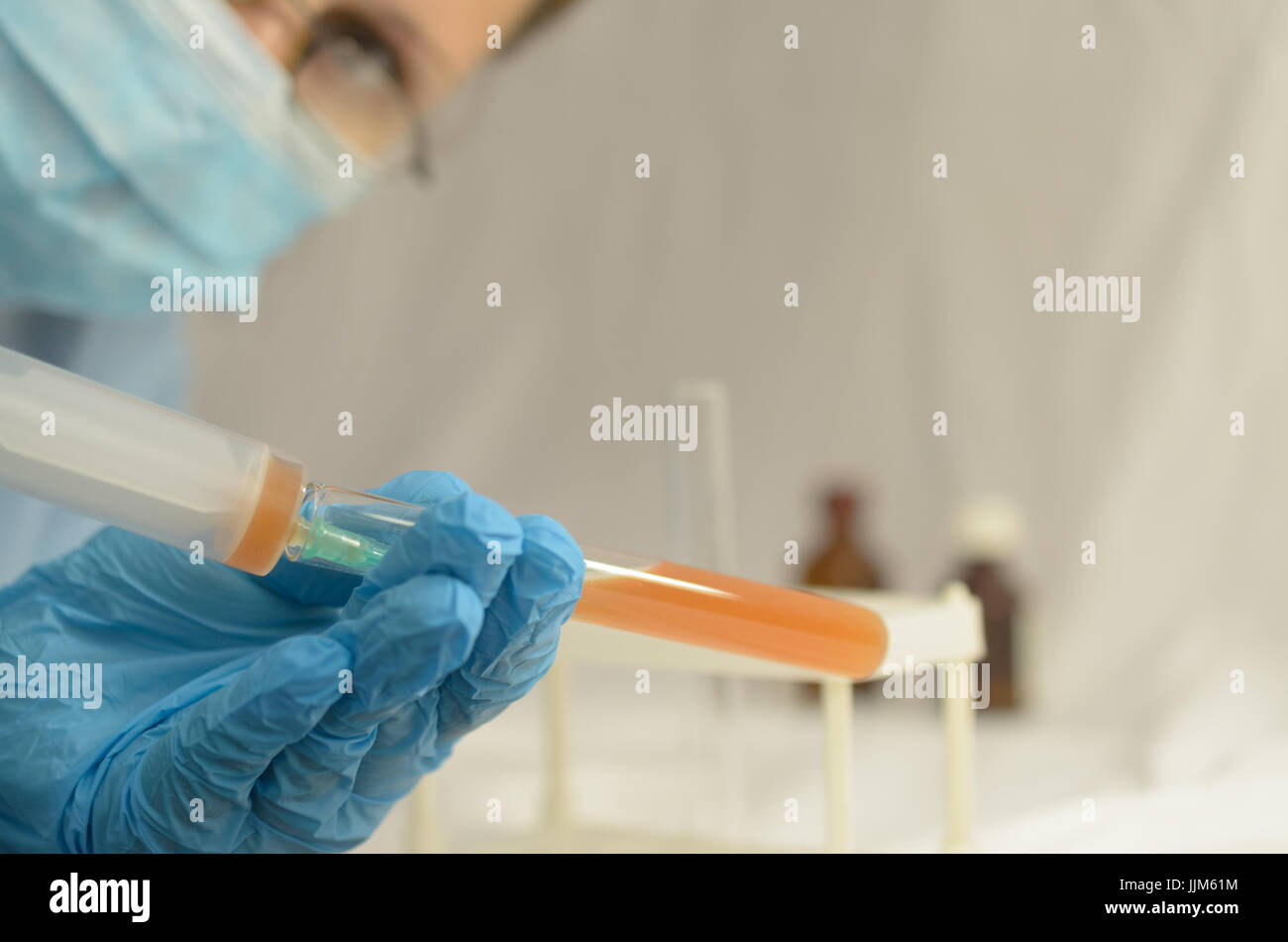 The doctor makes tests with a biological fluid Stock Photo - Alamy