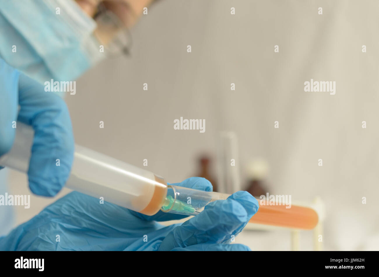 The doctor makes tests with a biological fluid Stock Photo - Alamy