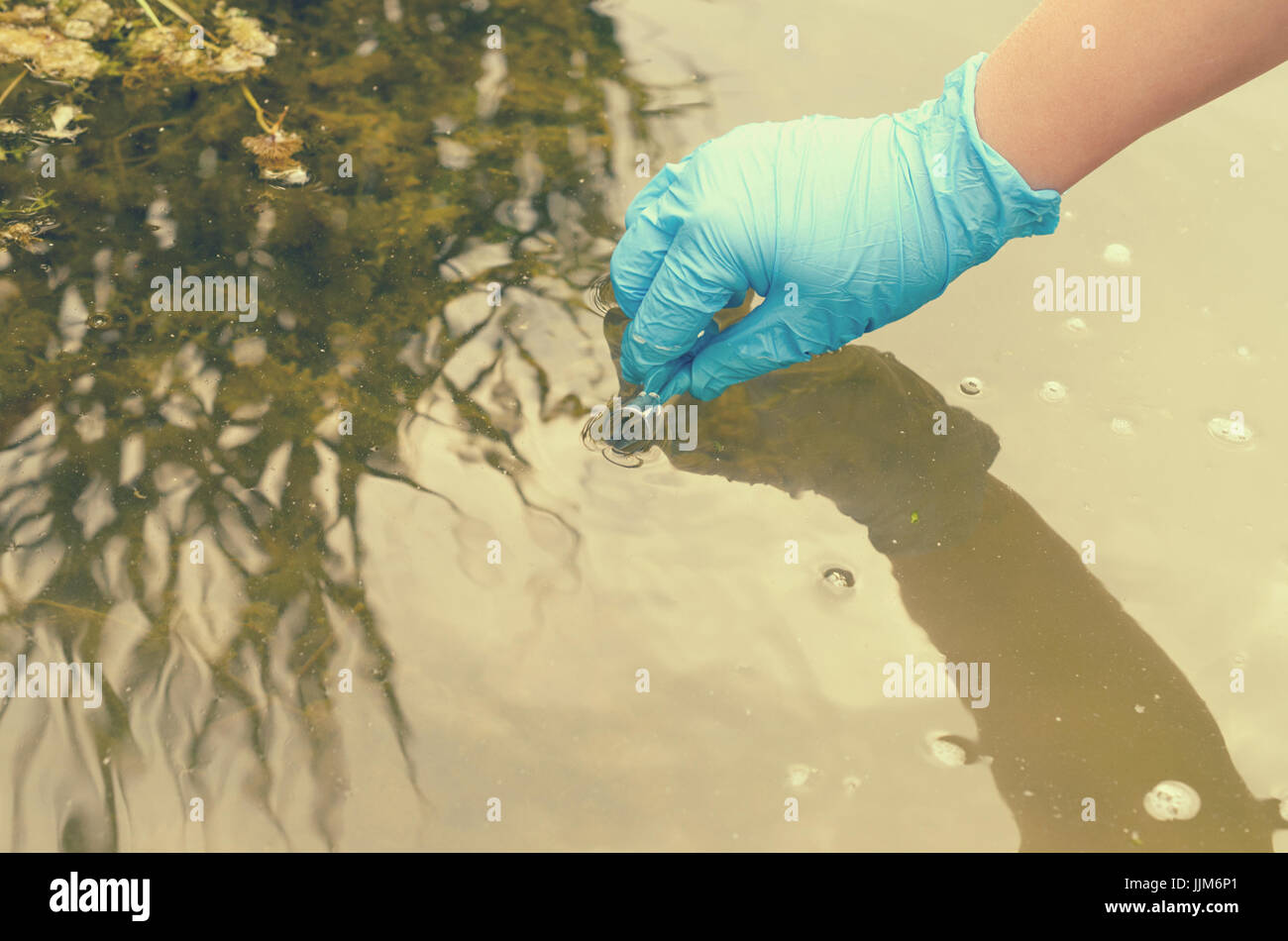 Taking a water test for analysis from a reservoir Stock Photo - Alamy