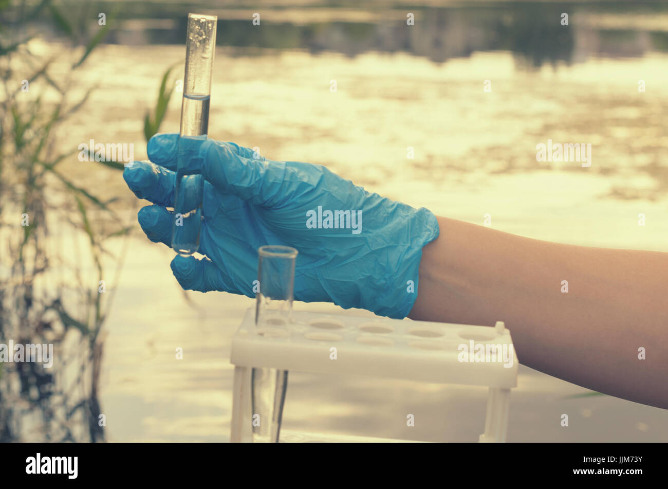 Taking a water test for analysis from a reservoir Stock Photo - Alamy