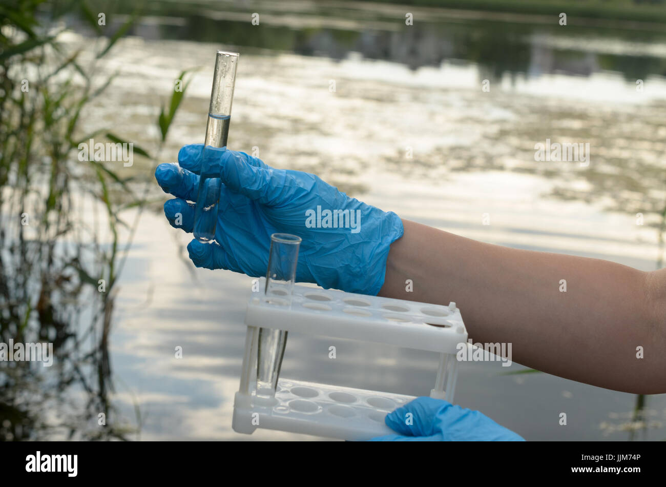 Taking a water test for analysis from a reservoir Stock Photo - Alamy