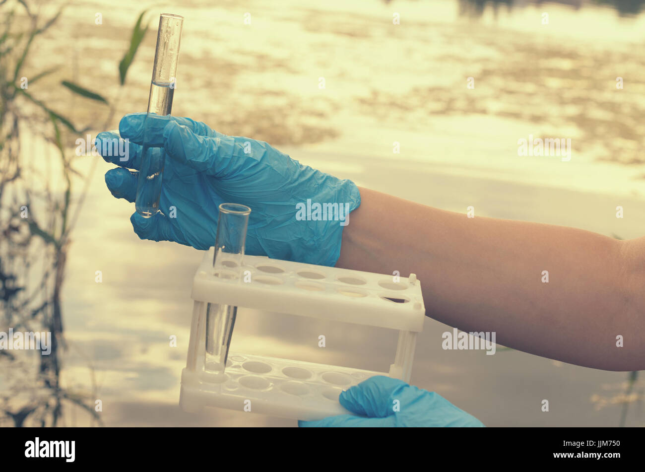 Taking a water test for analysis from a reservoir Stock Photo - Alamy