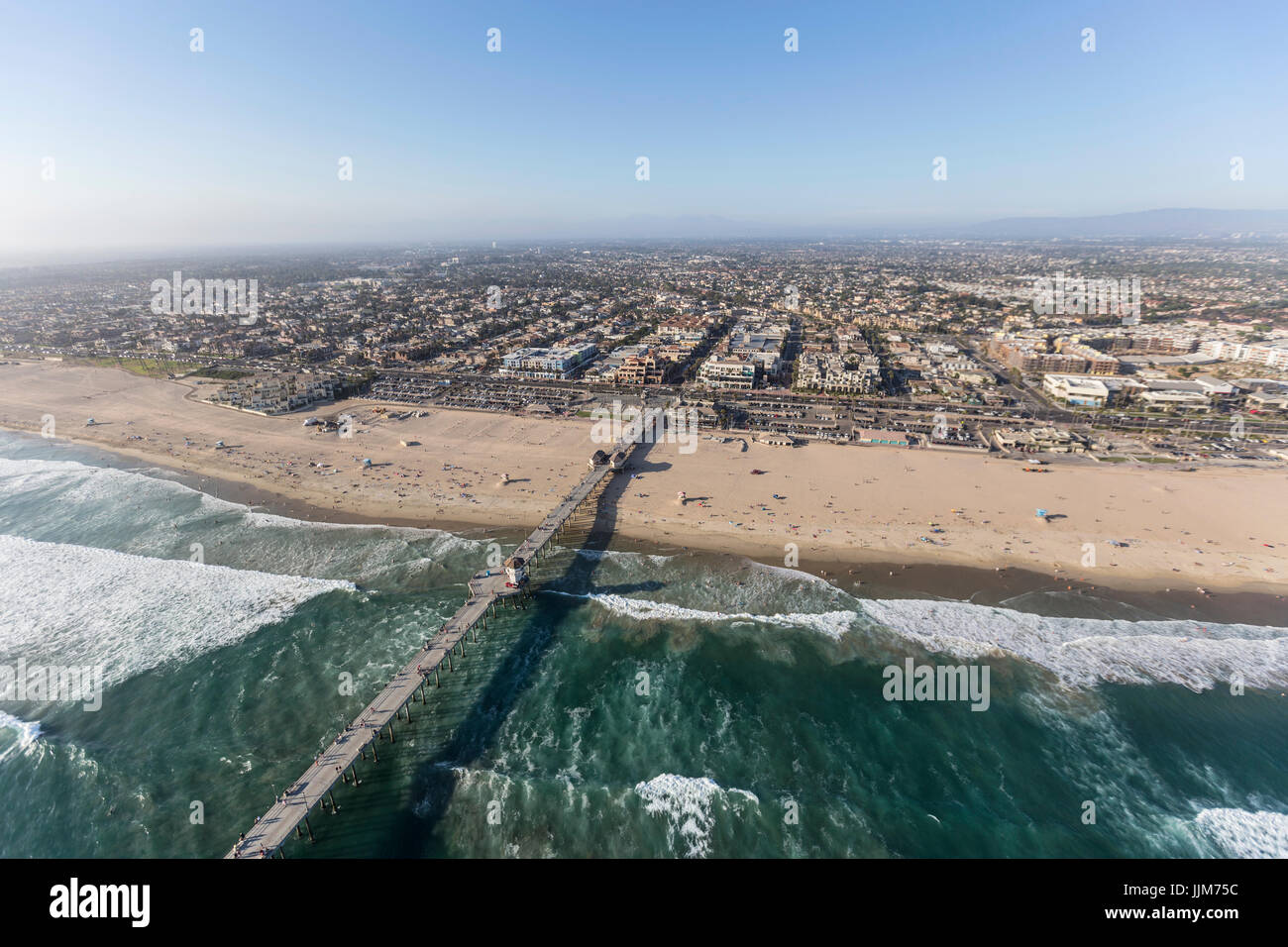 Aerial view of surf at Huntington Beach Pier in Southern California ...