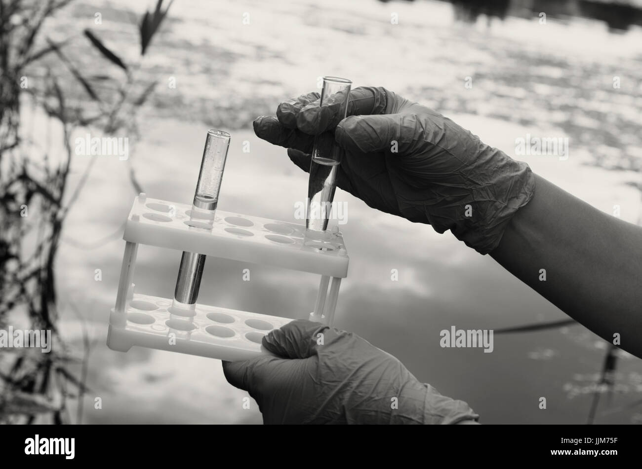Taking a water test for analysis from a reservoir Stock Photo - Alamy