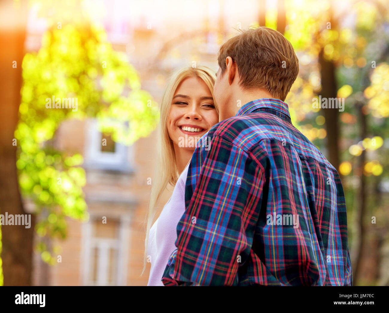 Spring couple walking park. Summer friends walk outdoor Stock Photo - Alamy