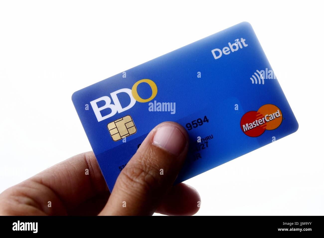 ANTIPOLO CITY, PHILIPPINES - JULY 17, 2017: A hand holds a BDO Debit ...