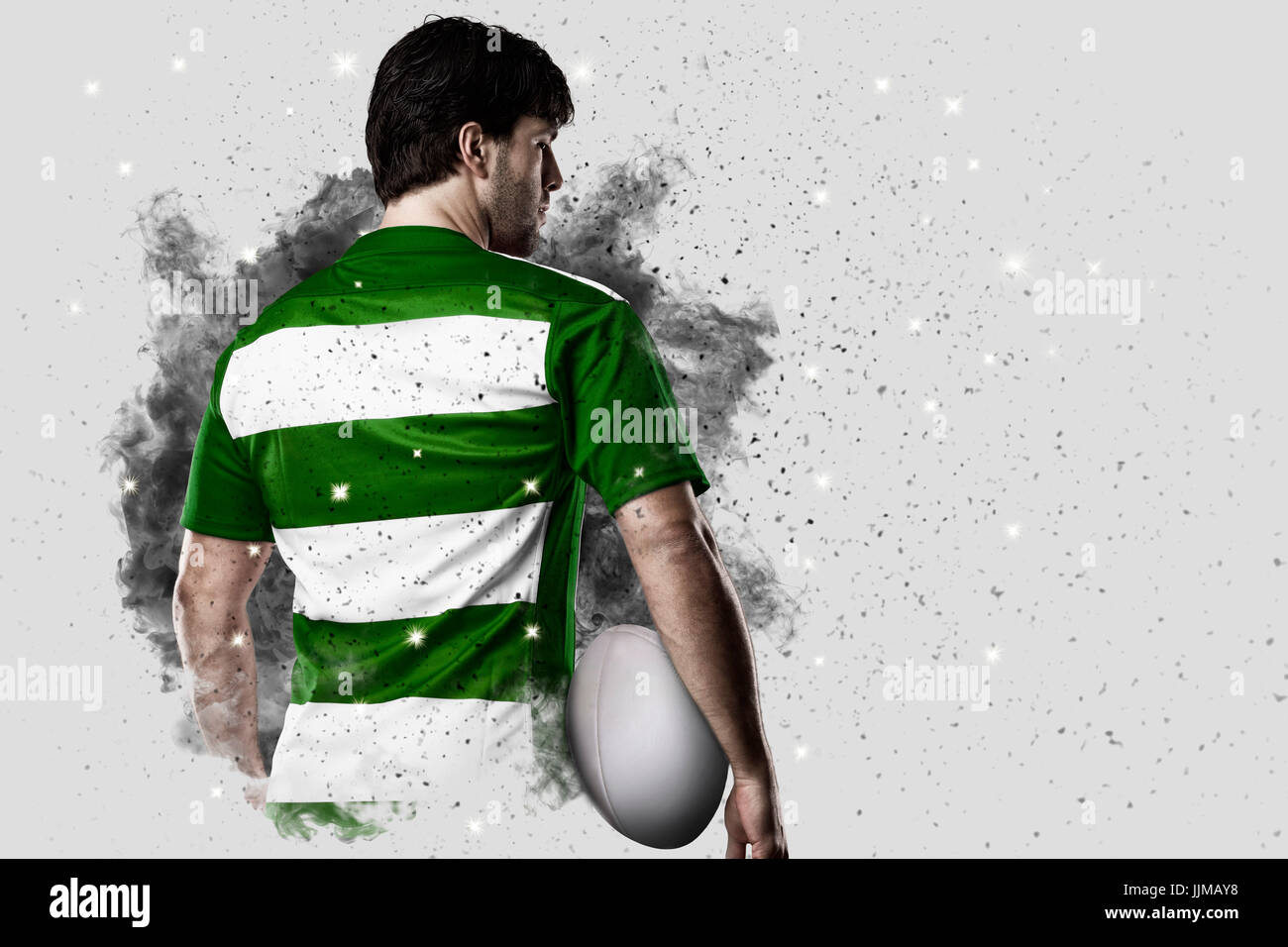 Rugby Player with a green uniform coming out of a blast of smoke Stock ...