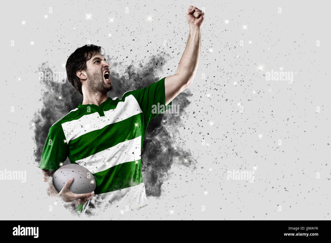 Rugby Player with a green uniform coming out of a blast of smoke Stock ...