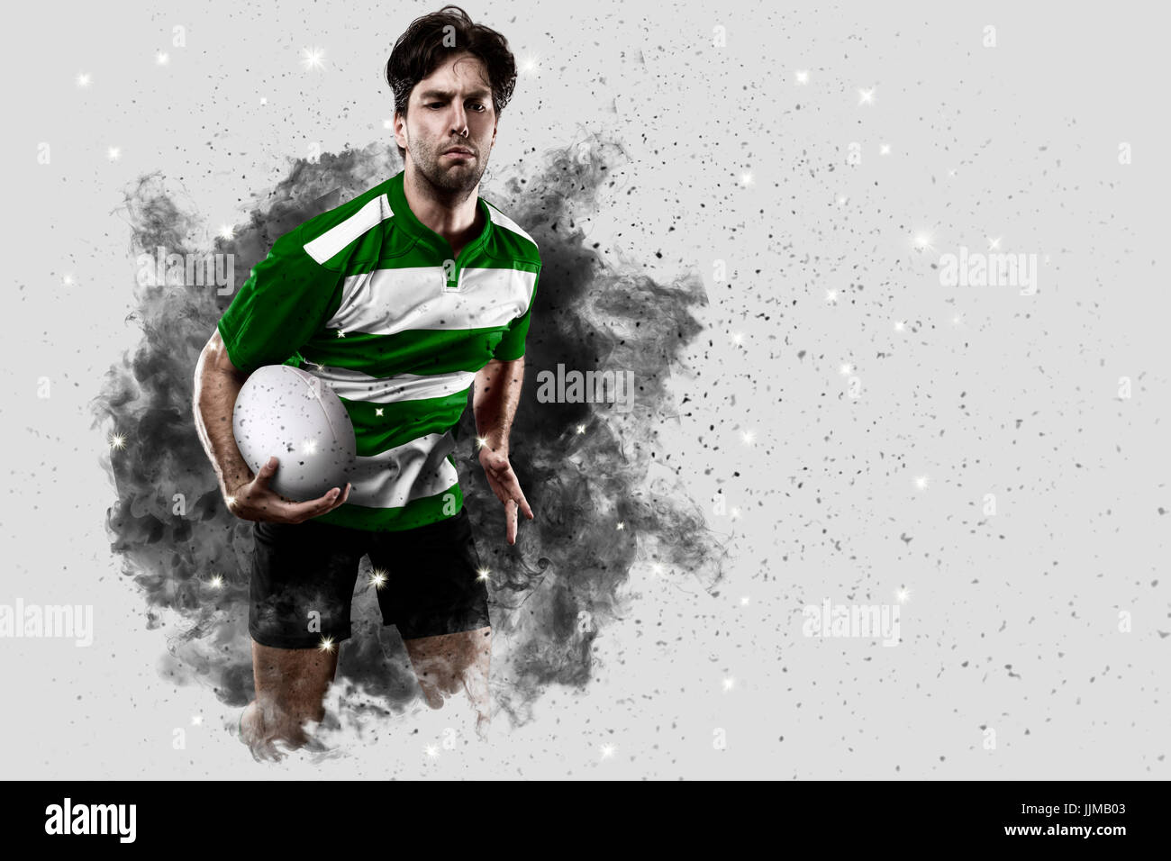 Rugby Player with a green uniform coming out of a blast of smoke Stock ...