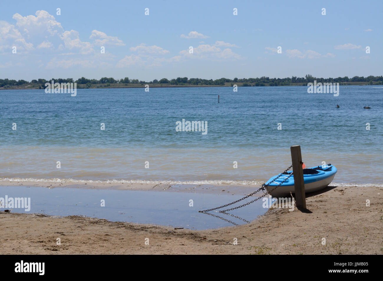 Save Download Preview Kayak on shore of lake at Standley Lake Regional ...
