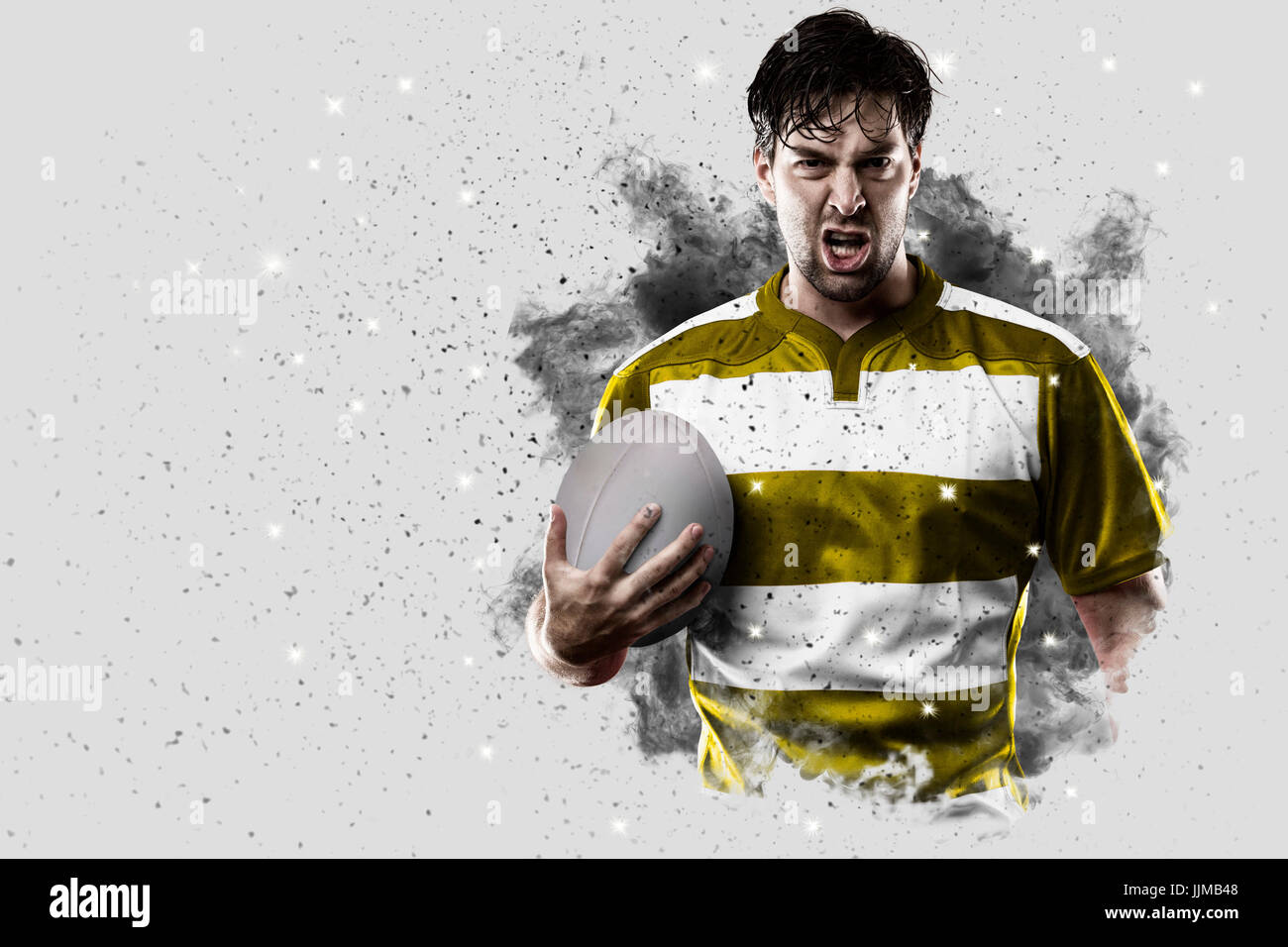 Rugby Player with a Yellow uniform coming out of a blast of smoke Stock ...