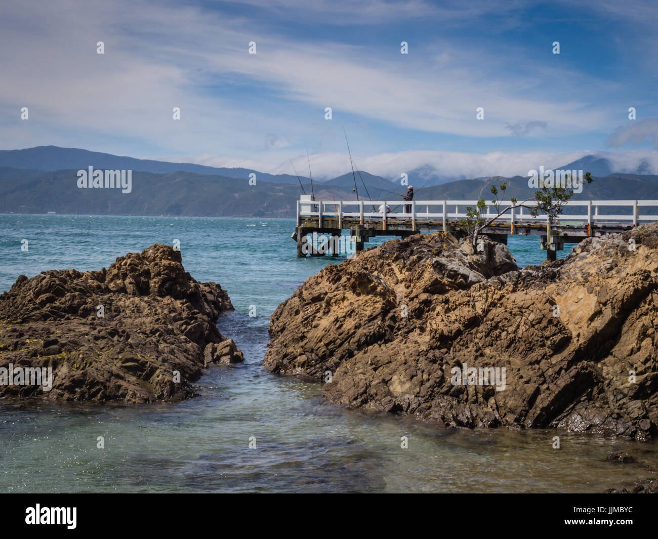 Jetty On Rock Shore Stock Photo - Alamy