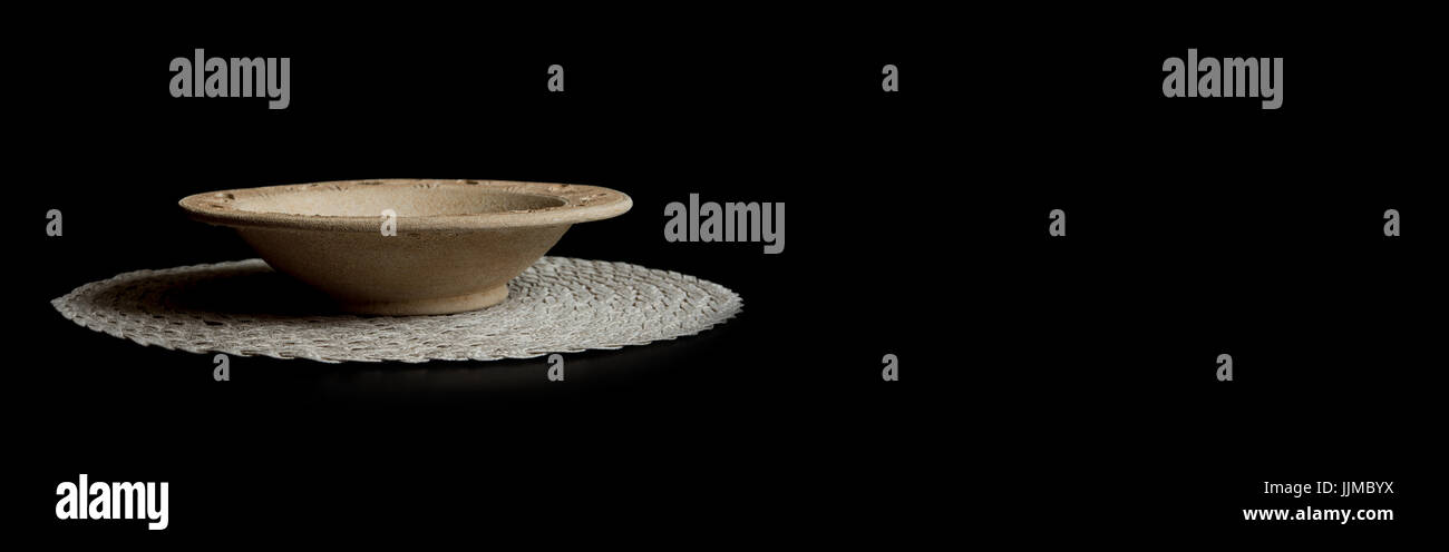 empty dish on black background with shadow Stock Photo - Alamy