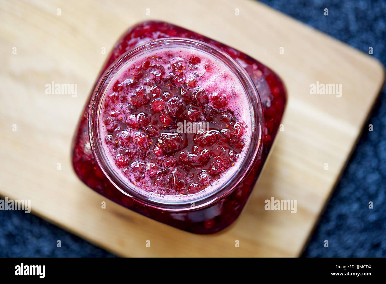 Transparent jar with red jam Stock Photo - Alamy