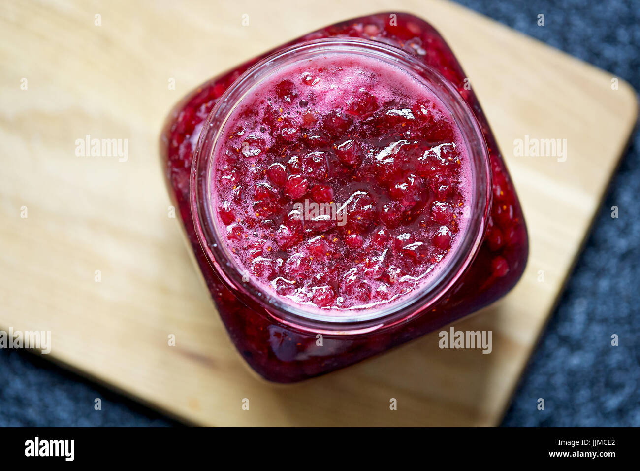 Transparent jar with red jam Stock Photo - Alamy