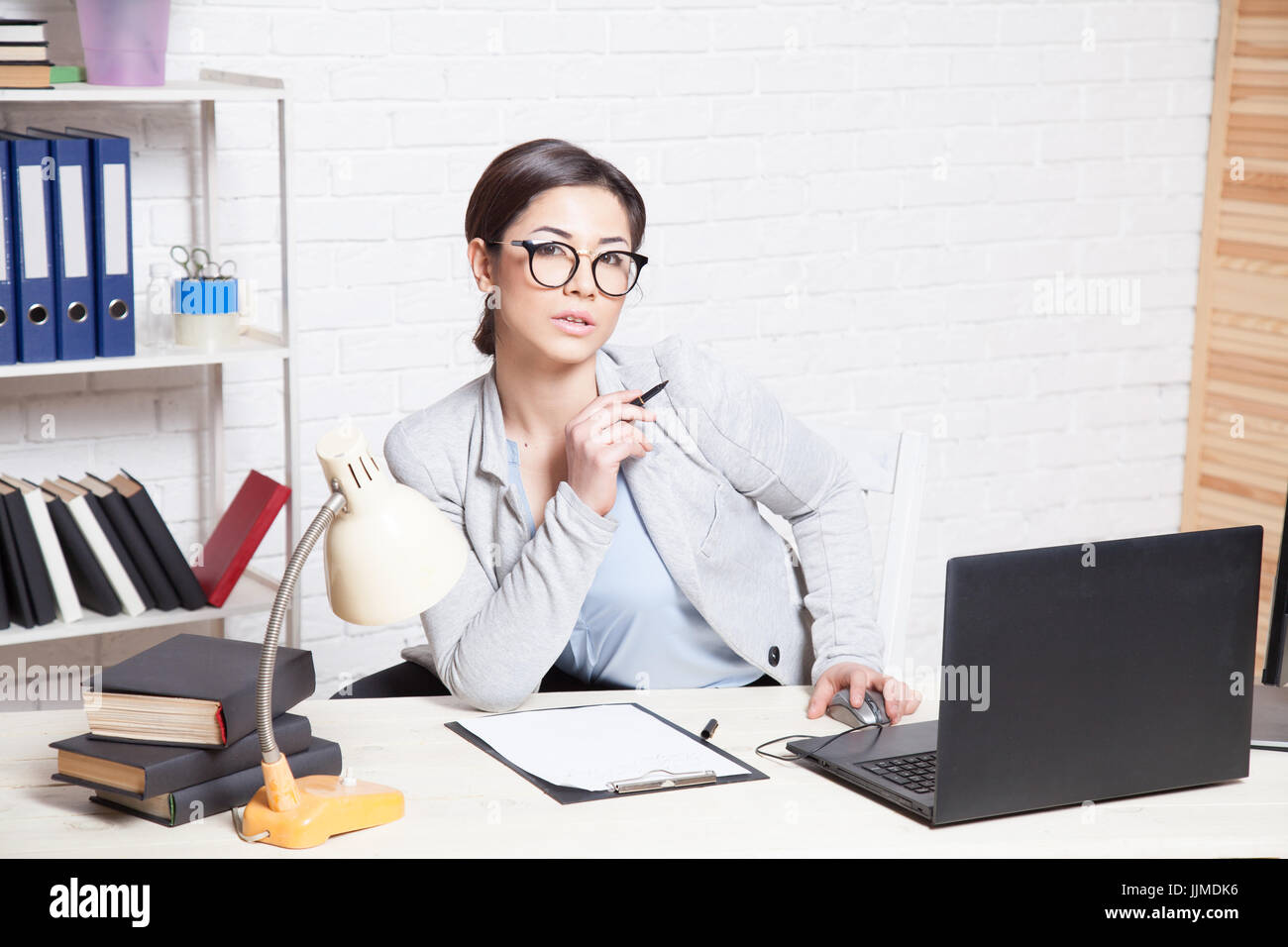 business woman in an Office works at the computer Stock Photo - Alamy