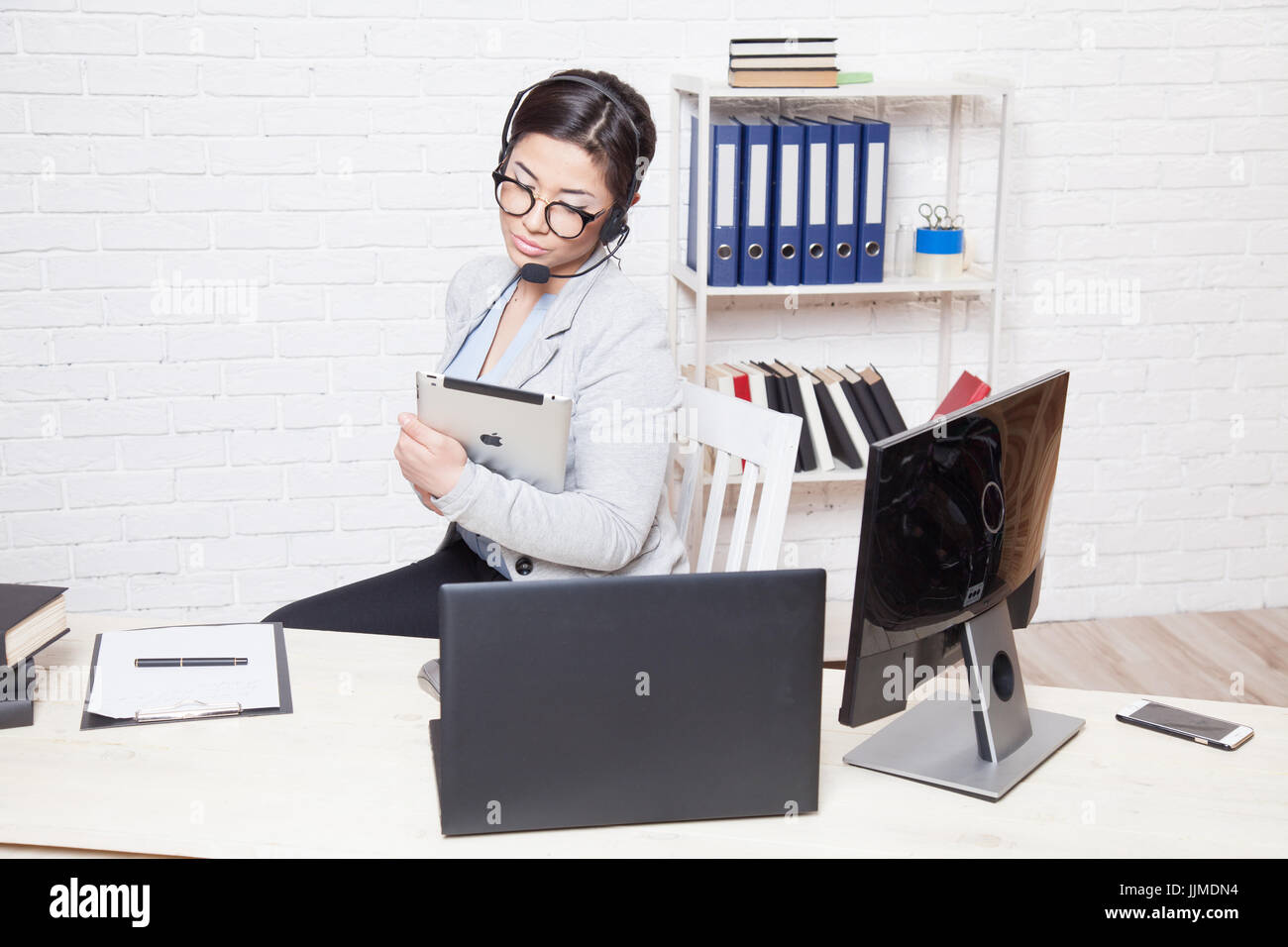 Office callcenter girl works at the computer Stock Photo - Alamy