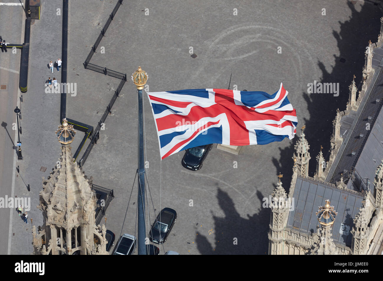 A close up aerial view of the Union Flag flying from the Houses of ...