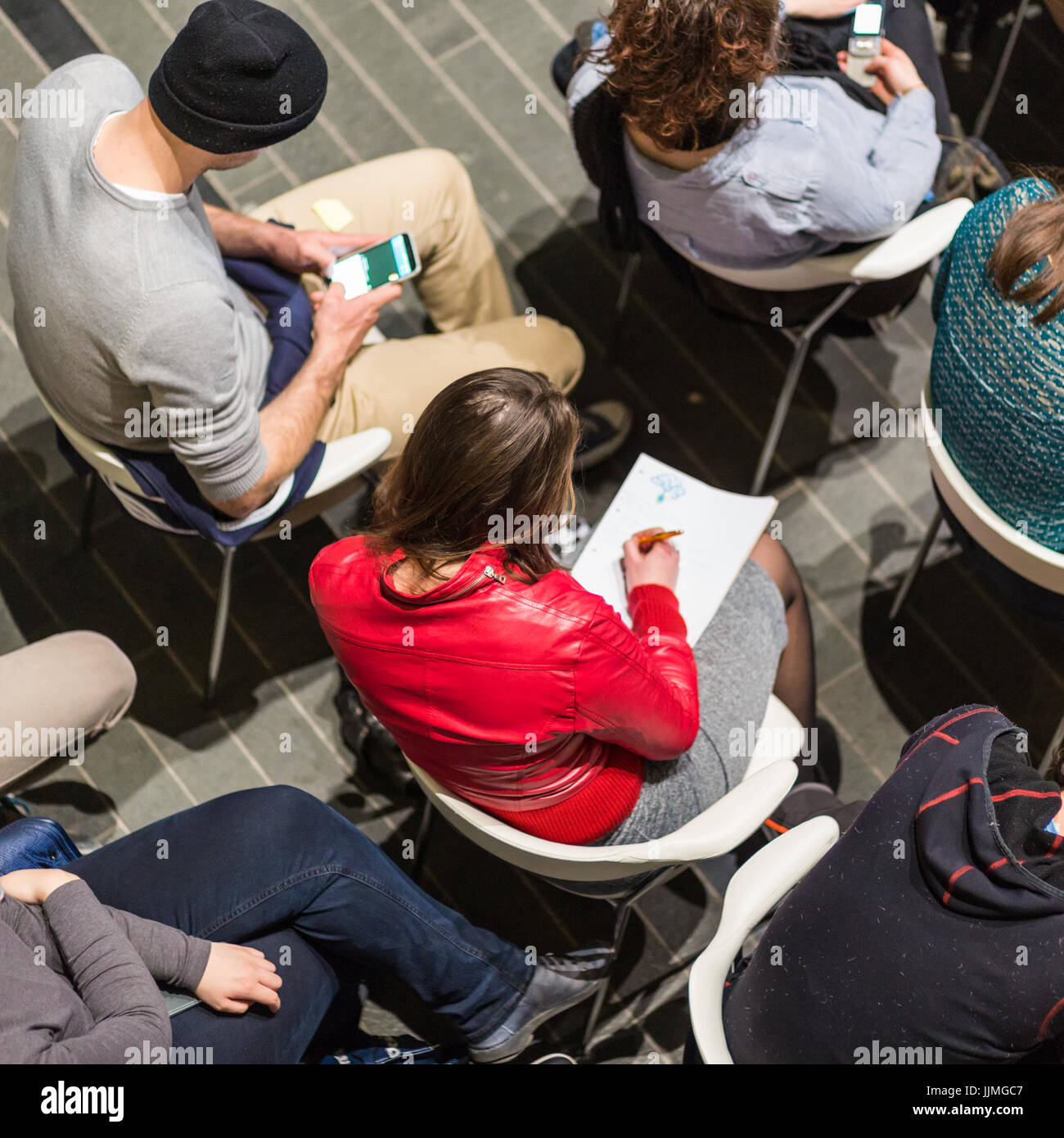 Audience in conference hall shot from abowe Stock Photo - Alamy