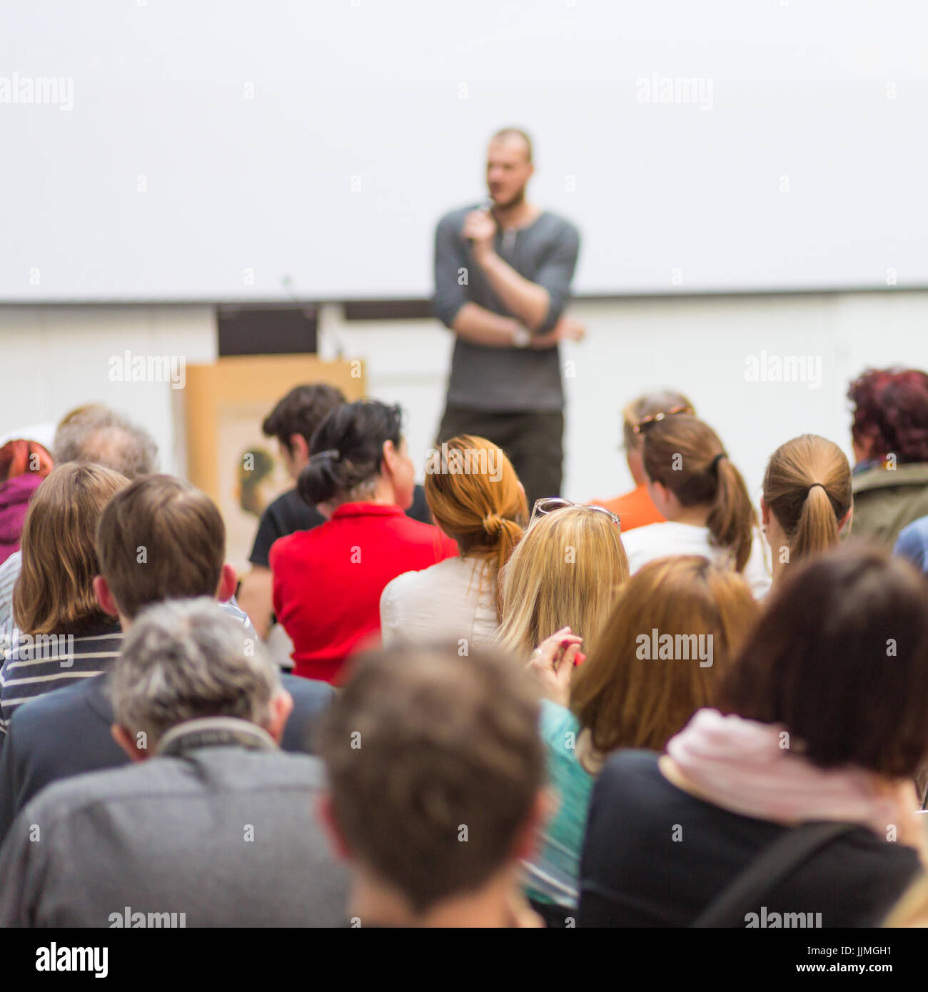 Man giving presentation in lecture hall at university Stock Photo - Alamy