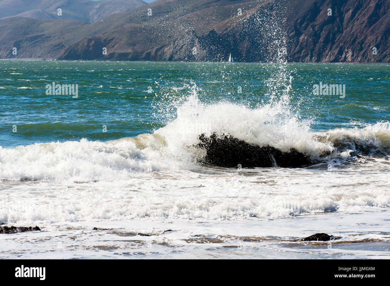 Water crashing into rock Stock Photo - Alamy