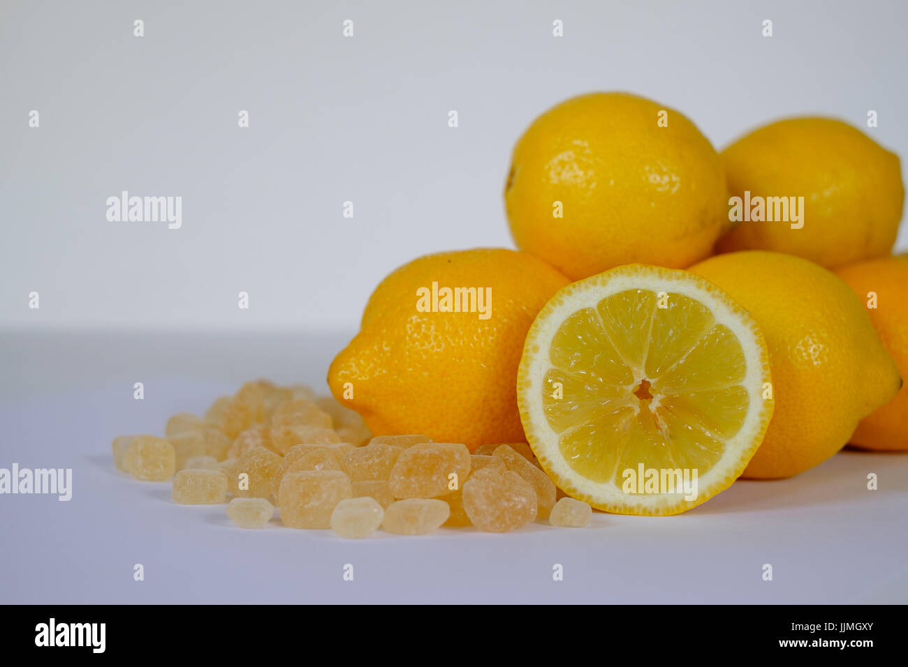 Lemon slice with sugar cane candy Stock Photo - Alamy