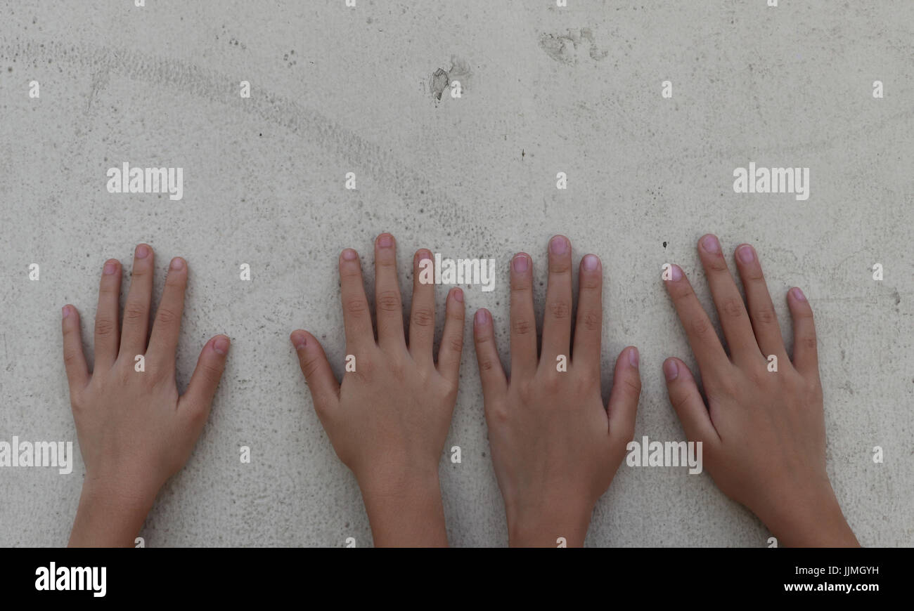 hands,focus at four hand on wall,full shape of hand Stock Photo - Alamy