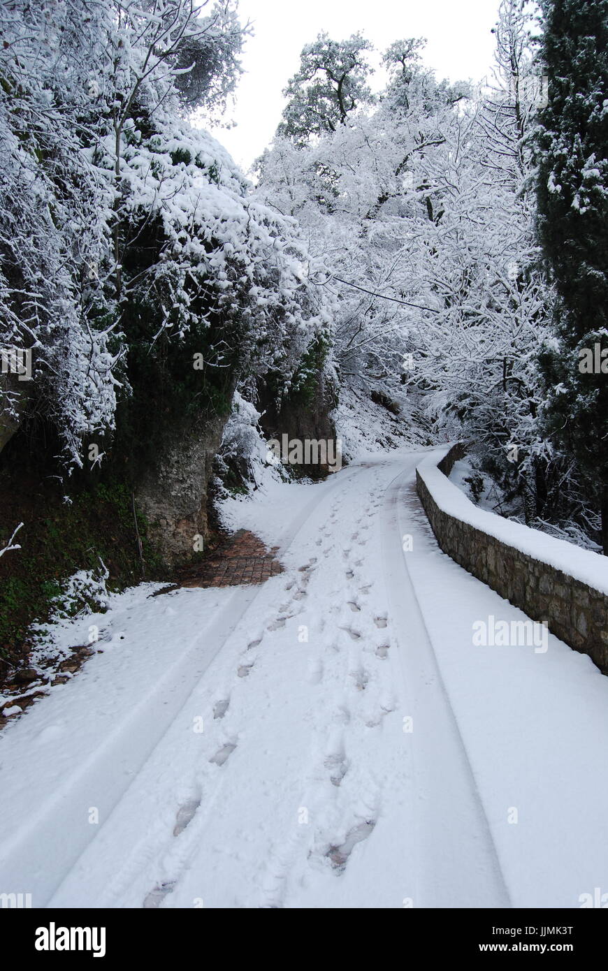 Snow on road Stock Photo - Alamy