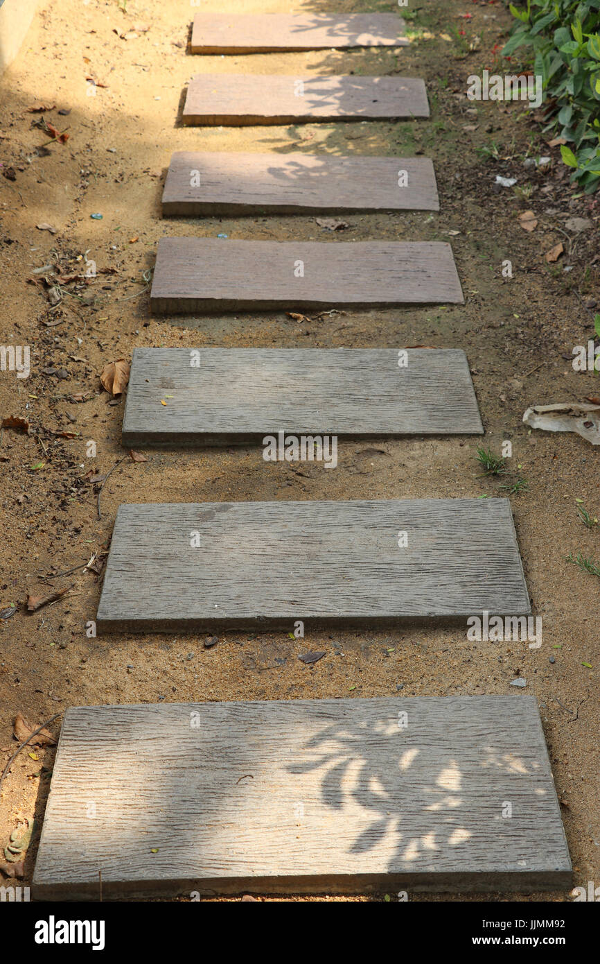 wooden plate to walk in green garden,focus at wooden step Stock Photo ...